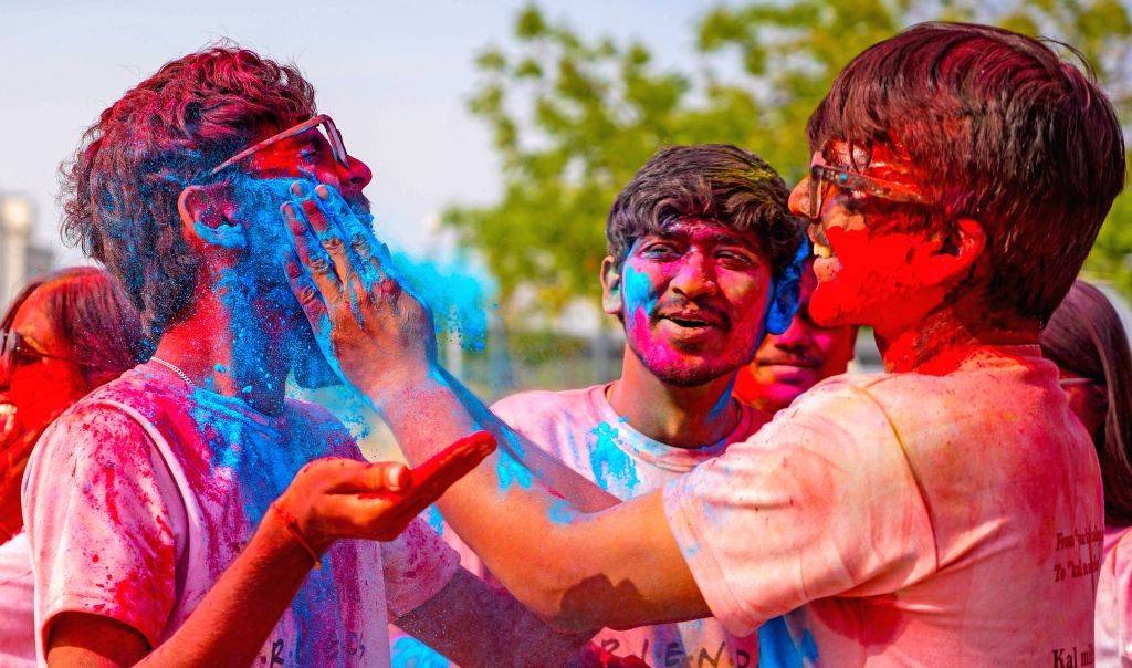 Ahmedabad : Students play with colours as they celebrate Holi at ...