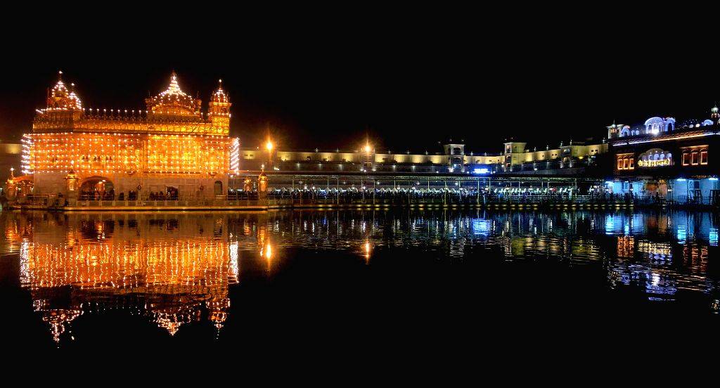Amritsar : Illuminated Golden Temple on the eve of the birth ...