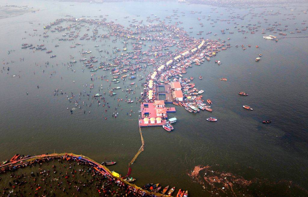 An aerial view of devotees taking a holy dip at the Triveni Sangam on ...