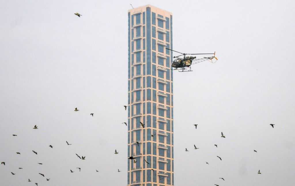 An army helicopter flies past during rehearsals ahead of the 'Vijay ...