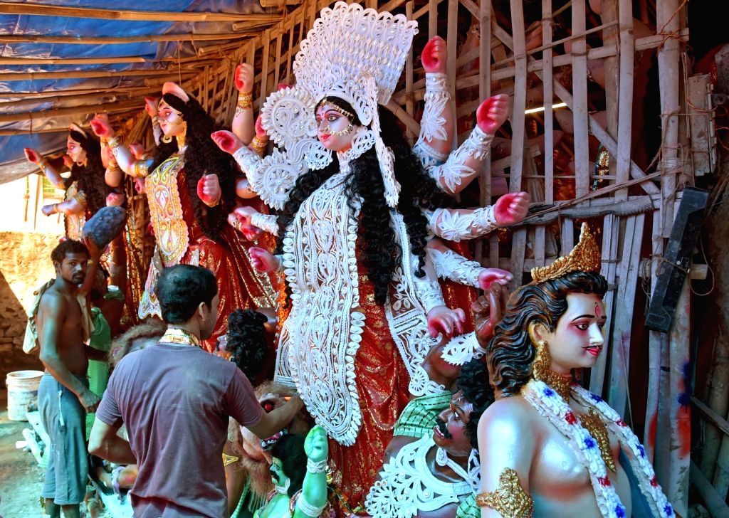 : Jaipur: An artisan decorates an idol of Goddess Durga