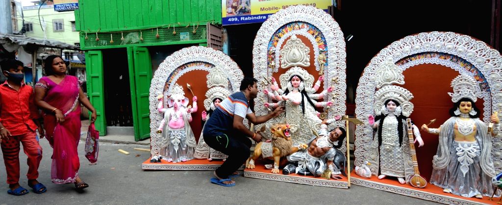 An artist Kaushik Ghosh gives finishing touches to a 4 ft fiberglass ...