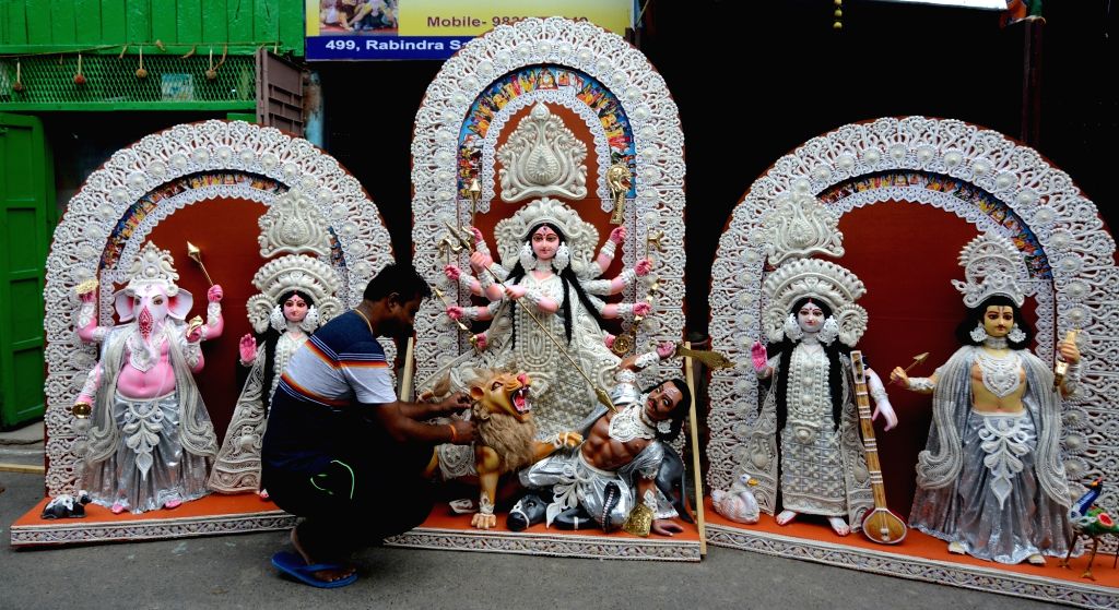 An artist Kaushik Ghosh gives finishing touches to a 4 ft fiberglass ...