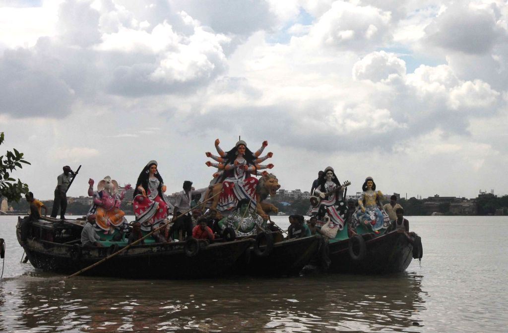 Durga idol being transported on boat