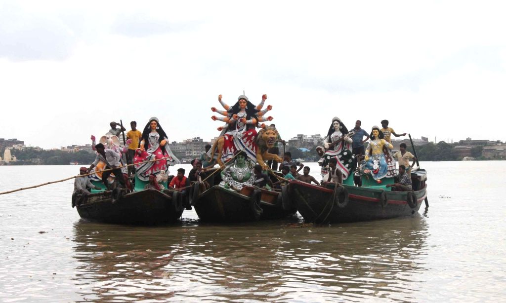 Durga idol being transported on boat