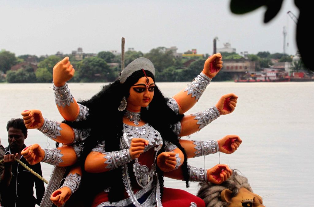 Durga idol being transported on boat