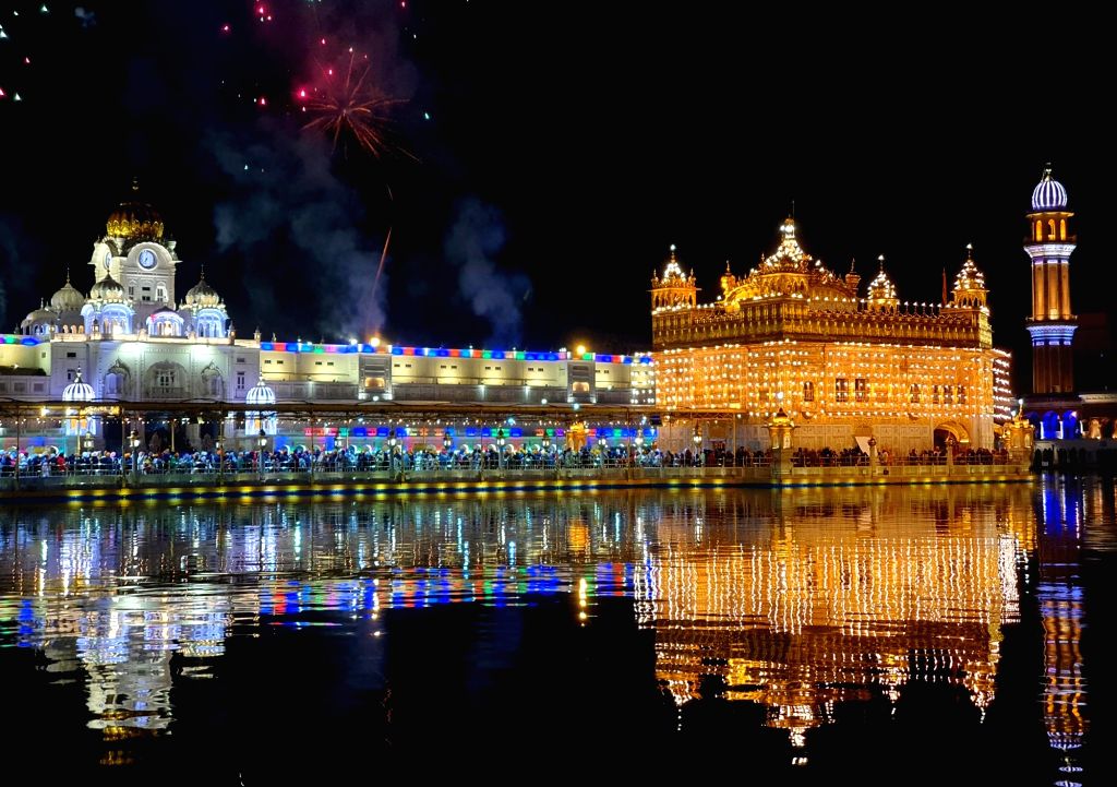 An illuminated Golden Temple on the occasion of the birth anniversary ...