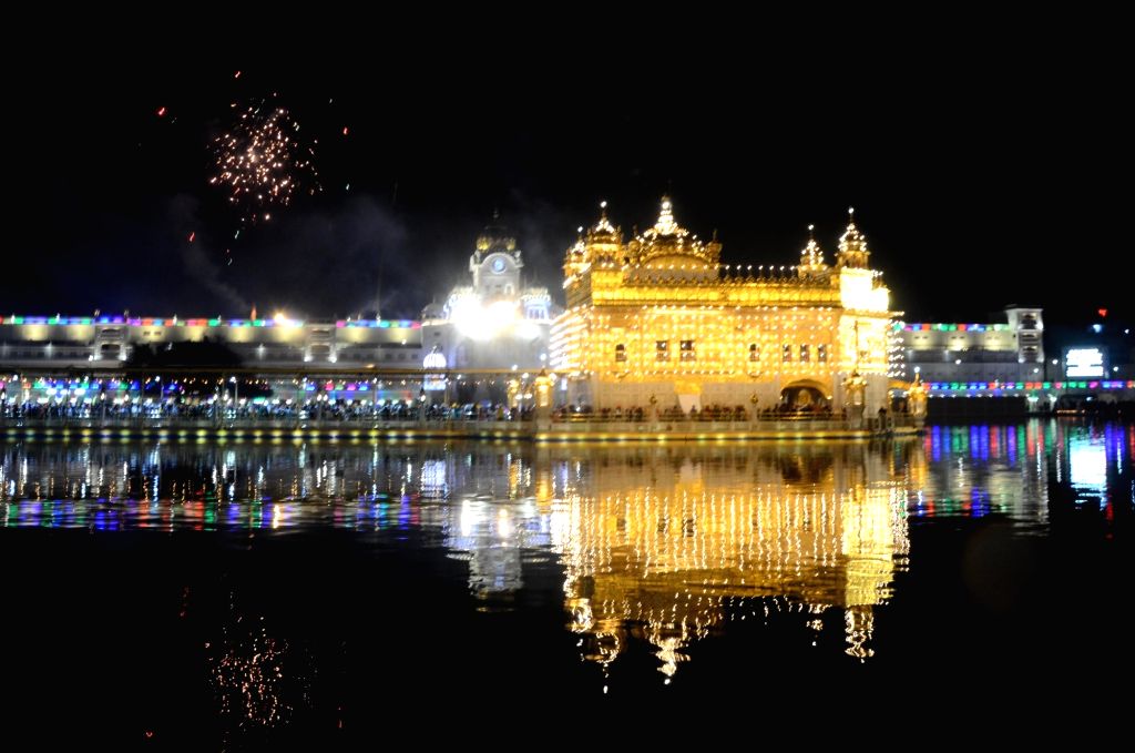 An illuminated Golden Temple on the occasion of the birth anniversary ...