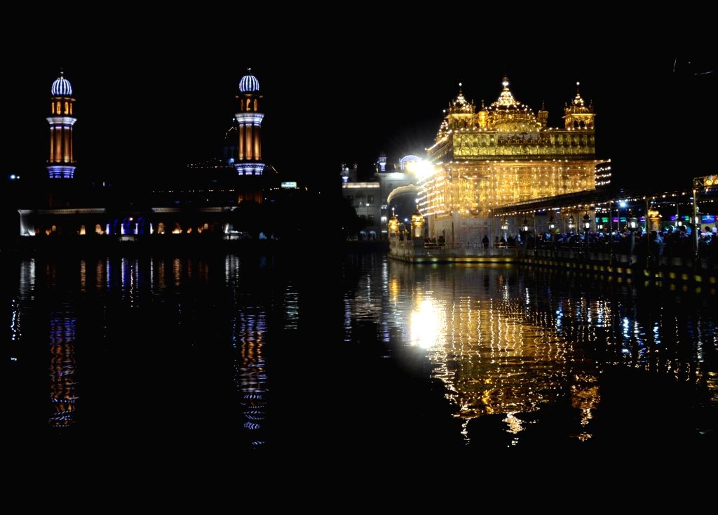 An illuminated Golden Temple on the occasion of the birth anniversary ...