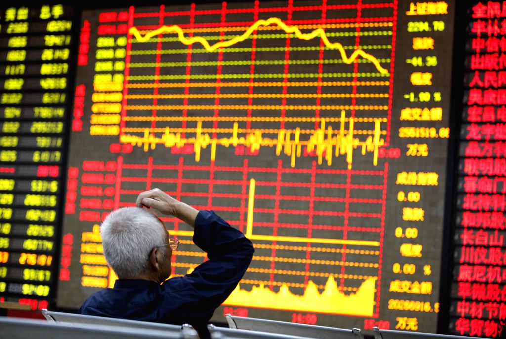 Chinese shares open lower; yuan strengthens