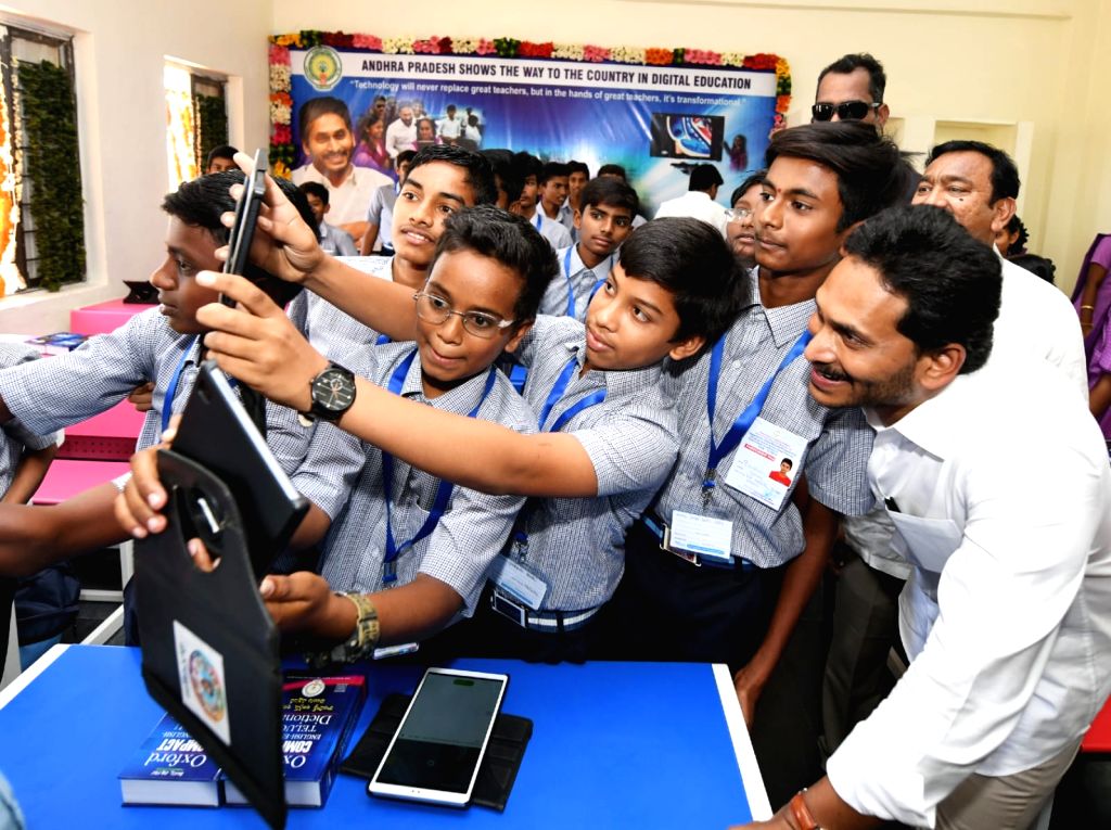 Free Photo : Andhra Pradesh CM sits in classroom