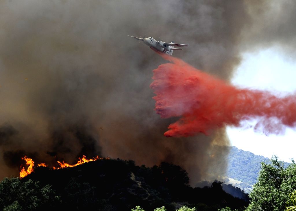 A huge bloom of smoke is seen in the hillside of north Monrovia