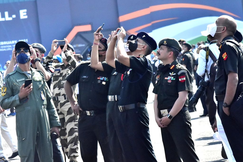 Army Aviation personnel watch various aircrafts on static display ...