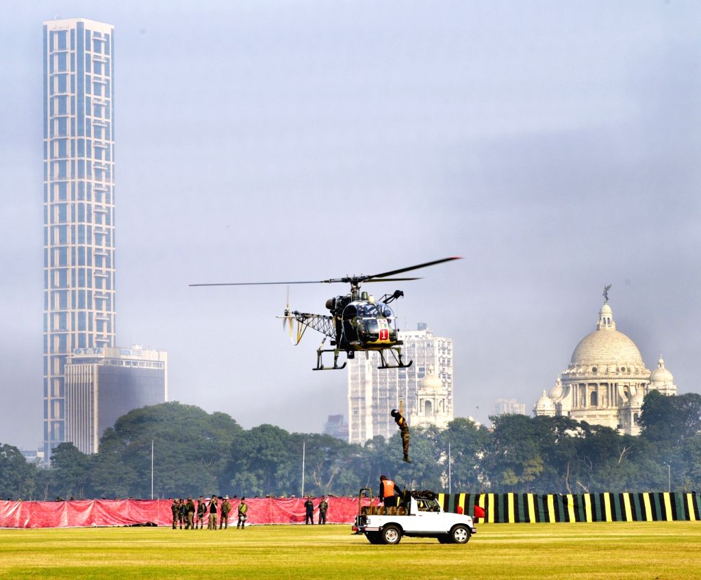 Army personnel in a chopper display their skill at the rehearsal