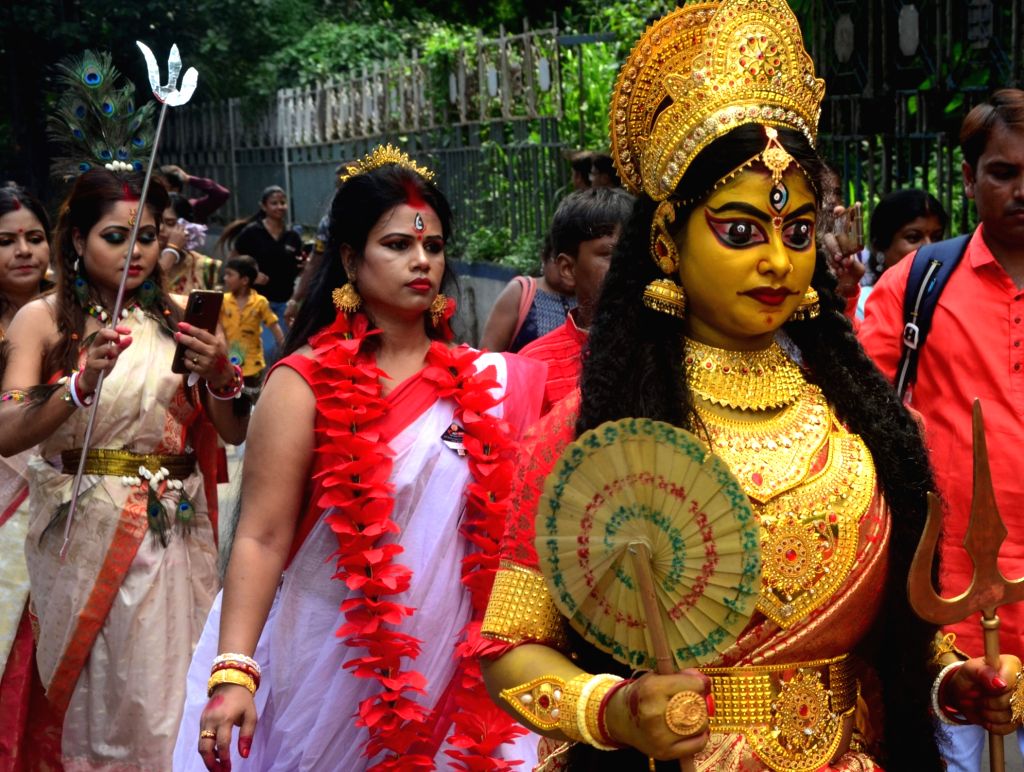 Artists dressed as Goddess Durga during a procession