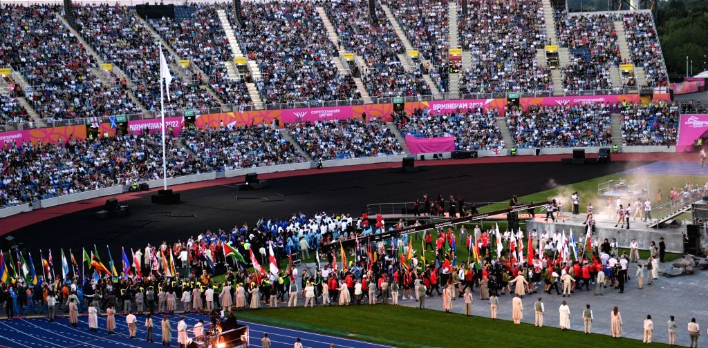 Athletes participate in the parade during the Commonwealth Games ...