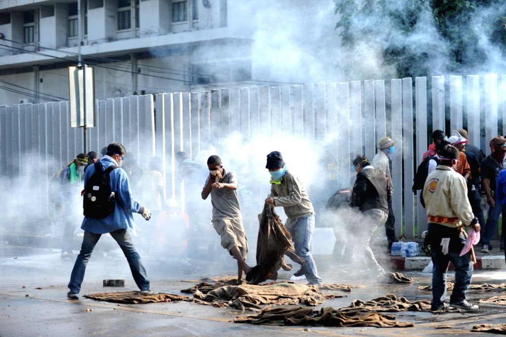 Anti-government protesters clash with riot policemen at a stadium in ...