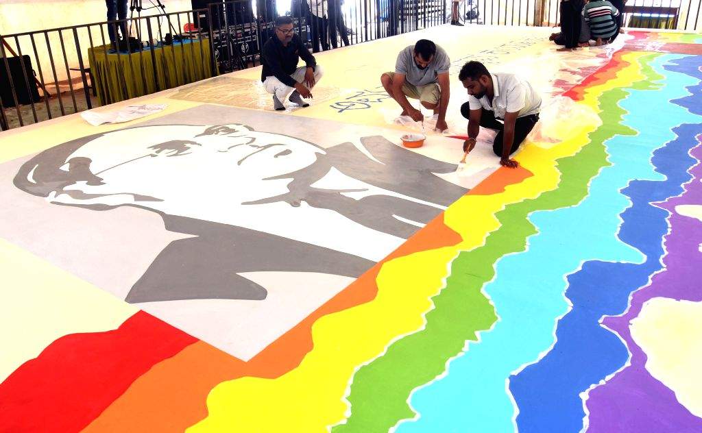 Artist paint a portrait of Dr. B.R. Ambedkar on the floor to create a ...