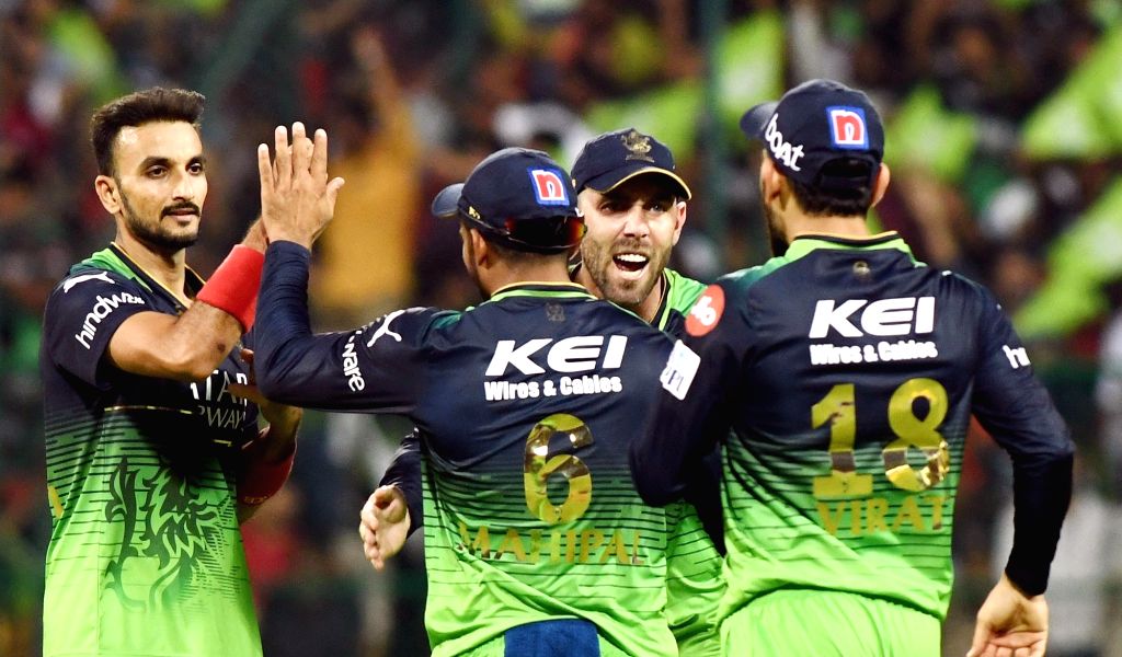 Bengaluru : RCB bowler Harshal Patel with teammates celebrate a dismissal