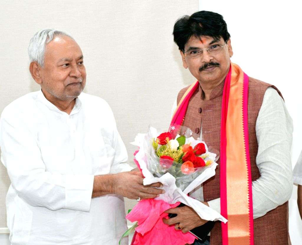 Bihar Chief Minister Nitish Kumar greets NDA candidates Manan Kumar and ...