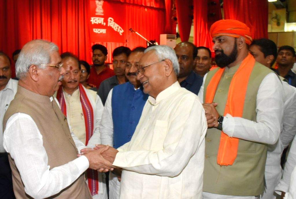 Bihar Chief Minister Nitish Kumar with his deputies Vijay Kumar Sinha ...