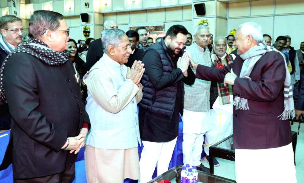 Bihar CM Nitish Kumar greets RJD leader Tejashwi Yadav during the ...