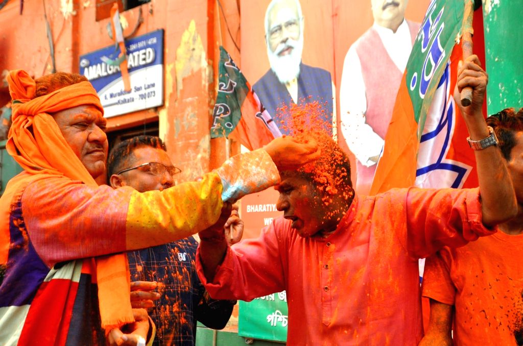 Kolkata : BJP activists smeared in colour celebrate as party leads in ...