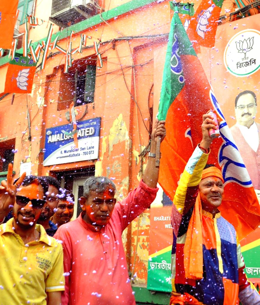 Kolkata : BJP activists smeared in colour celebrate as party leads in ...