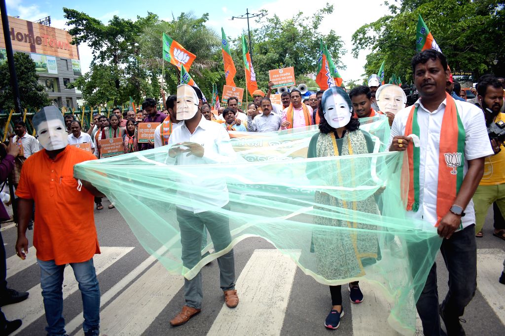 BJP activists stage a protest rally over increasing cases of Dengue and ...