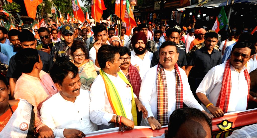 BJP activists take out a protest rally against the State Government