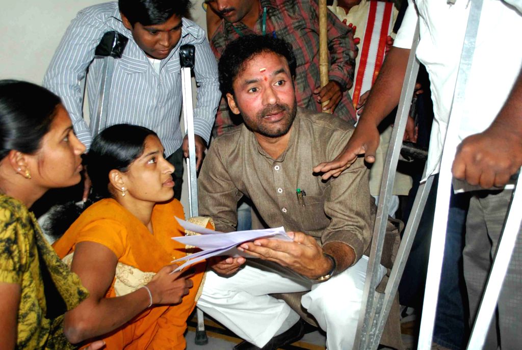BJP AP state president distributing wheel tricycle to physically ...
