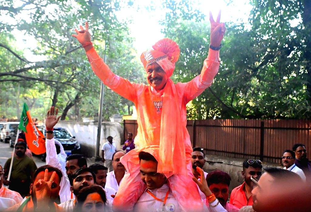 BJP candidate Bhimrao Tapkir flashes victory sign after winning the ...