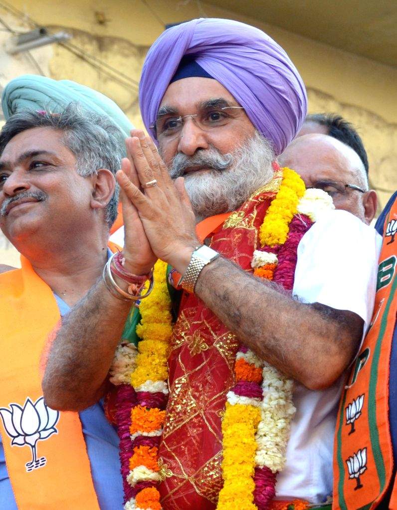 BJP candidate from Amritsar constituency Taranjit Singh Sandhu holds a ...