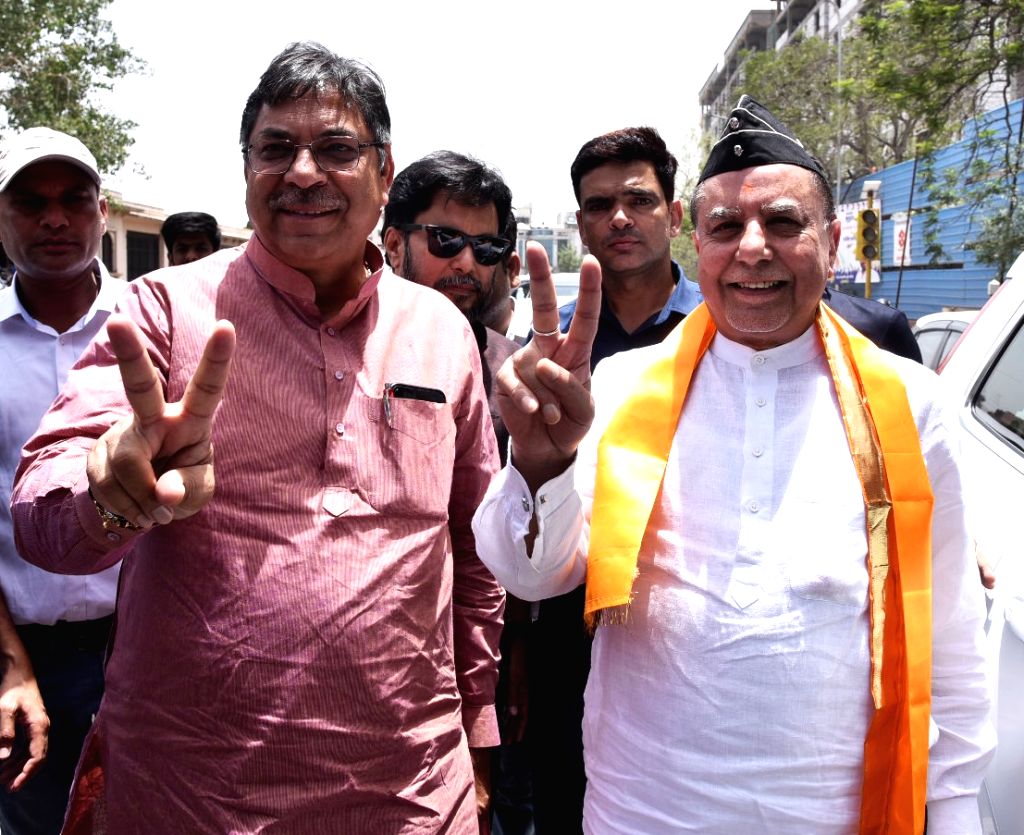 : Jaipur: BJP candidate Subhash Chandra shows victory sign after filing ...