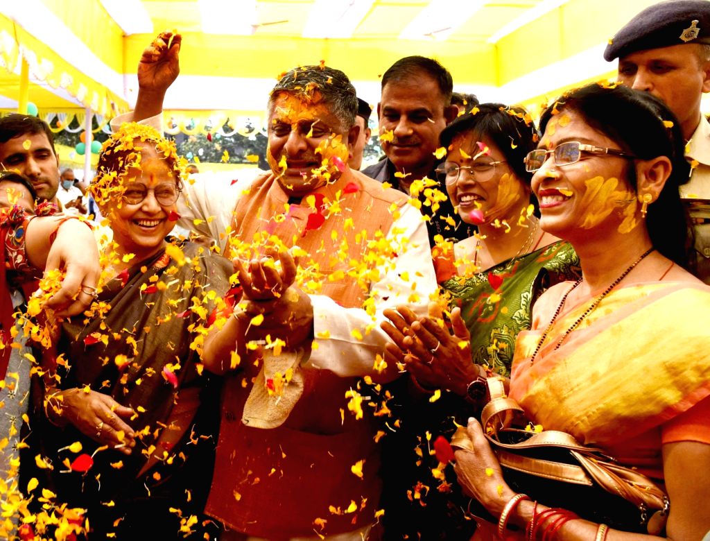 BJP leader and MP Ravi Shankar Prasad celebrate Holi with party workers.
