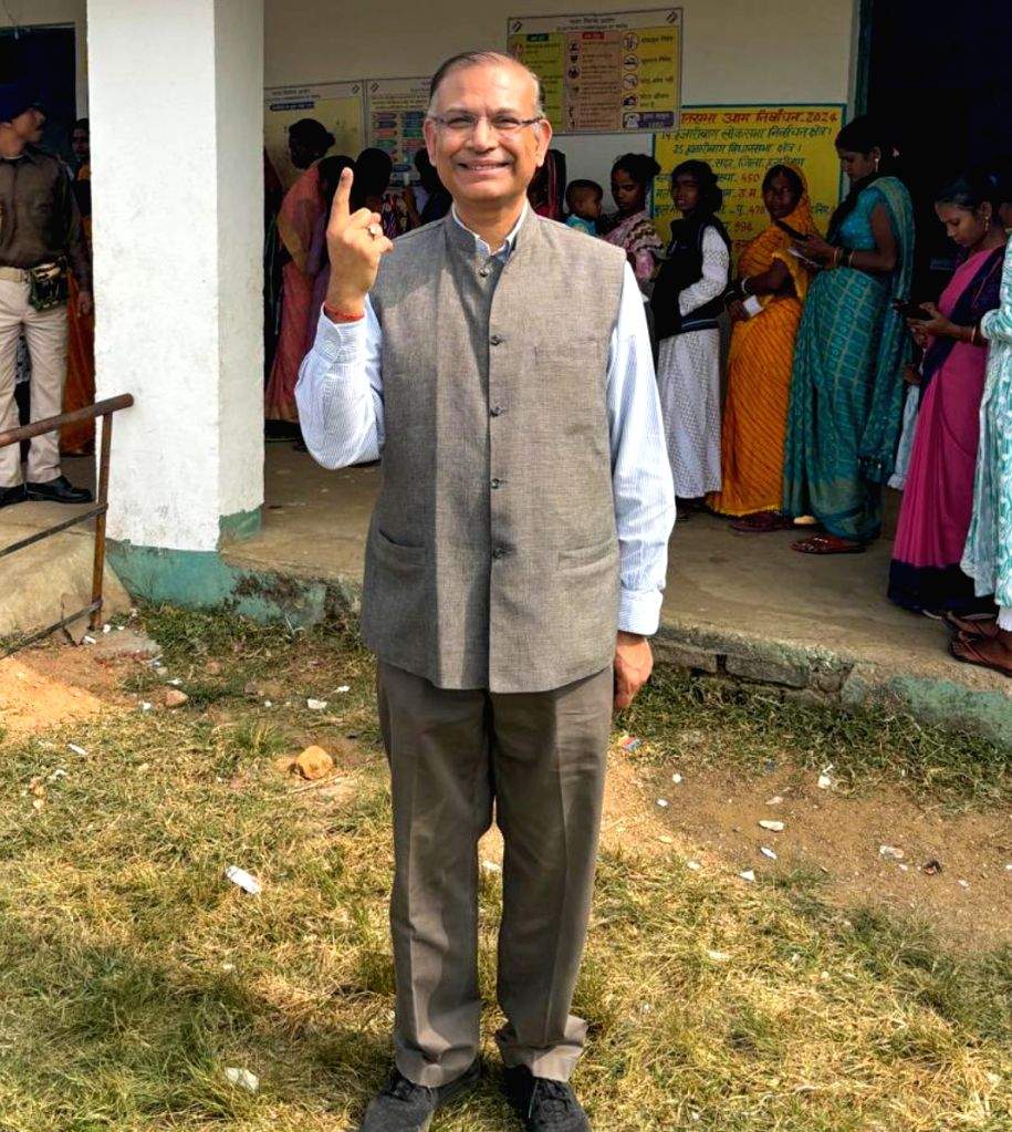 BJP leader Jayant Sinha shows his ink-marked finger after casting his vote