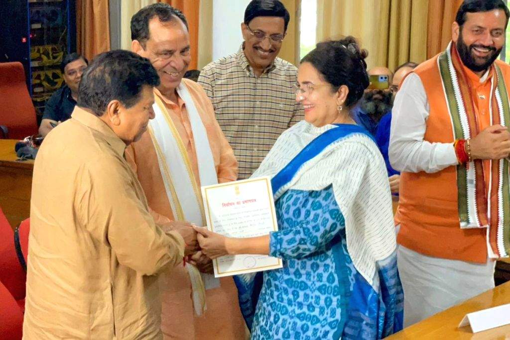 BJP leader Kiran Choudhry receives her victory certificate from ...