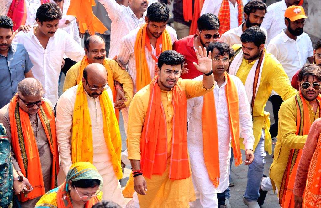 BJP leader Tejasvi Surya with party candidate Harish Dwivedi during an ...