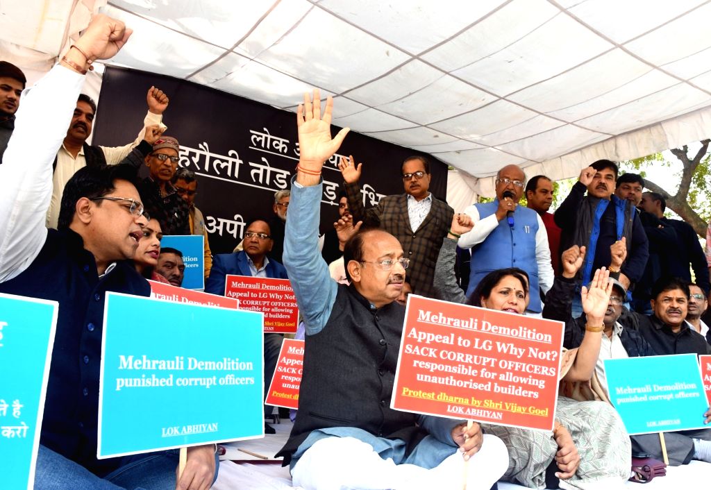 BJP leader Vijay Goel with party workers stage a dharna