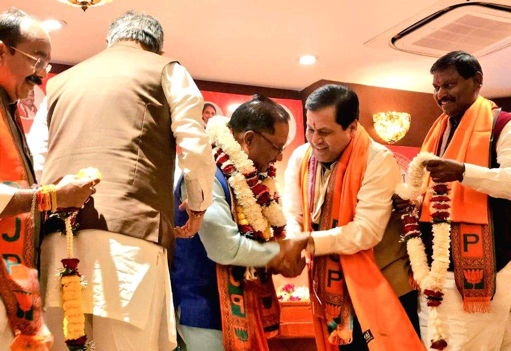 BJP leader Vishnu Deo Sai being garlanded by party leaders after he was ...