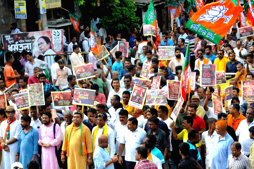 BJP leaders and activists take part in a protest rally (Maha Michil)