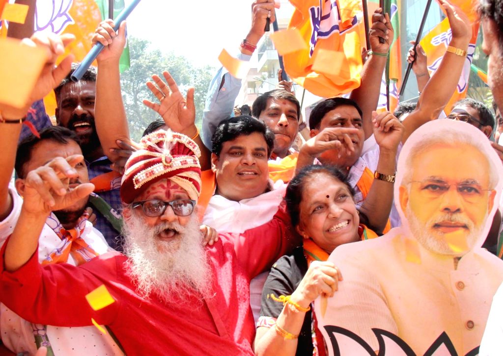 BJP leaders and workers celebrating the BJP victory in UP, Goa, Manipur ...