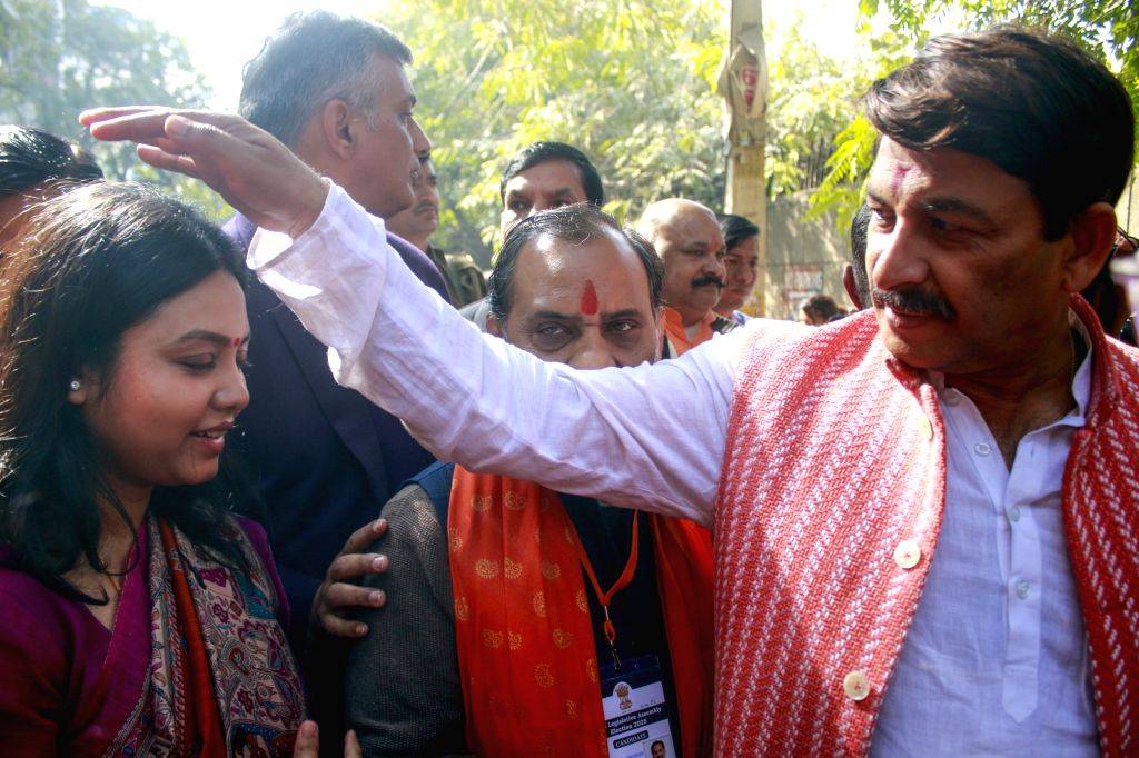 BJP MP Manoj Tiwari casts his vote for the Delhi Assembly Elections
