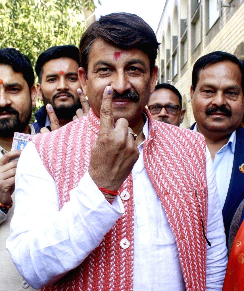 BJP MP Manoj Tiwari casts his vote for the Delhi Assembly Elections
