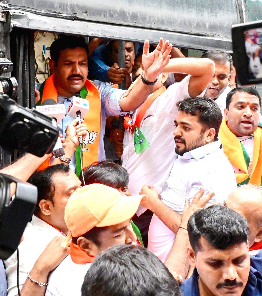 BJP State President B.Y. Vijayendra, along with party leaders stages a ...