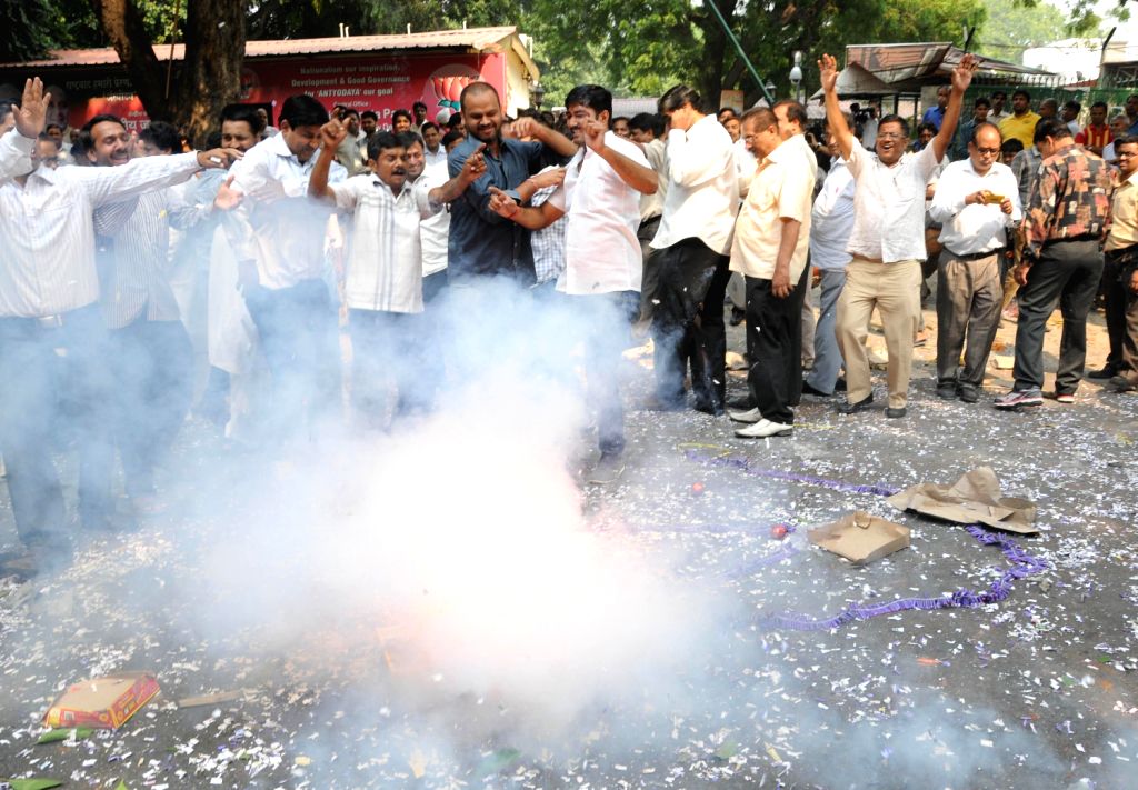 BJP supporters celebrate as Dr. Harsh Vardhan becomes chief ministerial ...