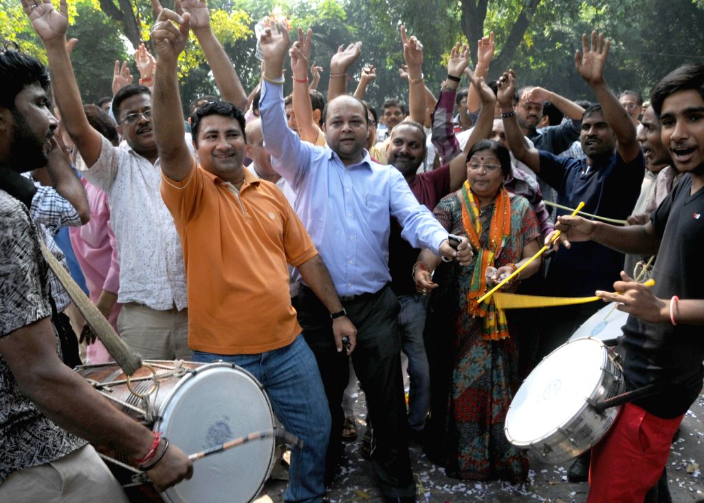 BJP supporters celebrate as Dr. Harsh Vardhan becomes chief ministerial ...