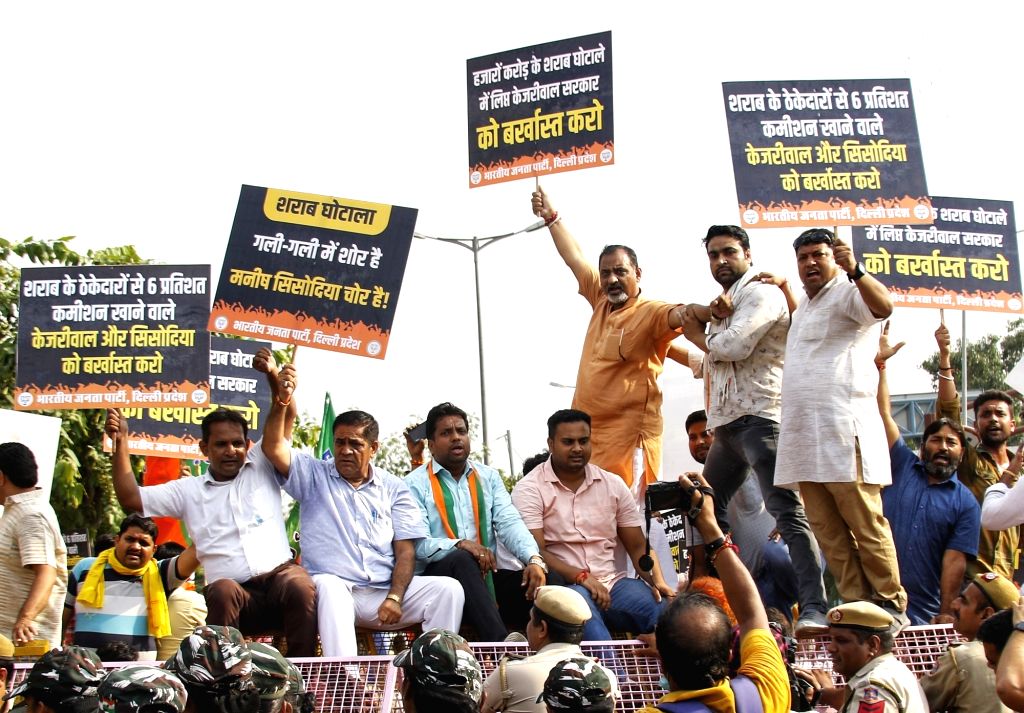 BJP workers and supporters demonstrate against New Excise Policy