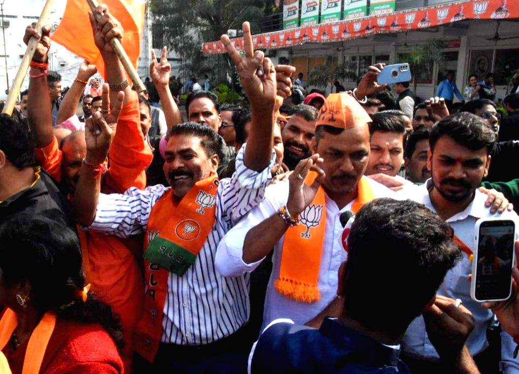 BJP workers and supporters outside the party headquarters during ...