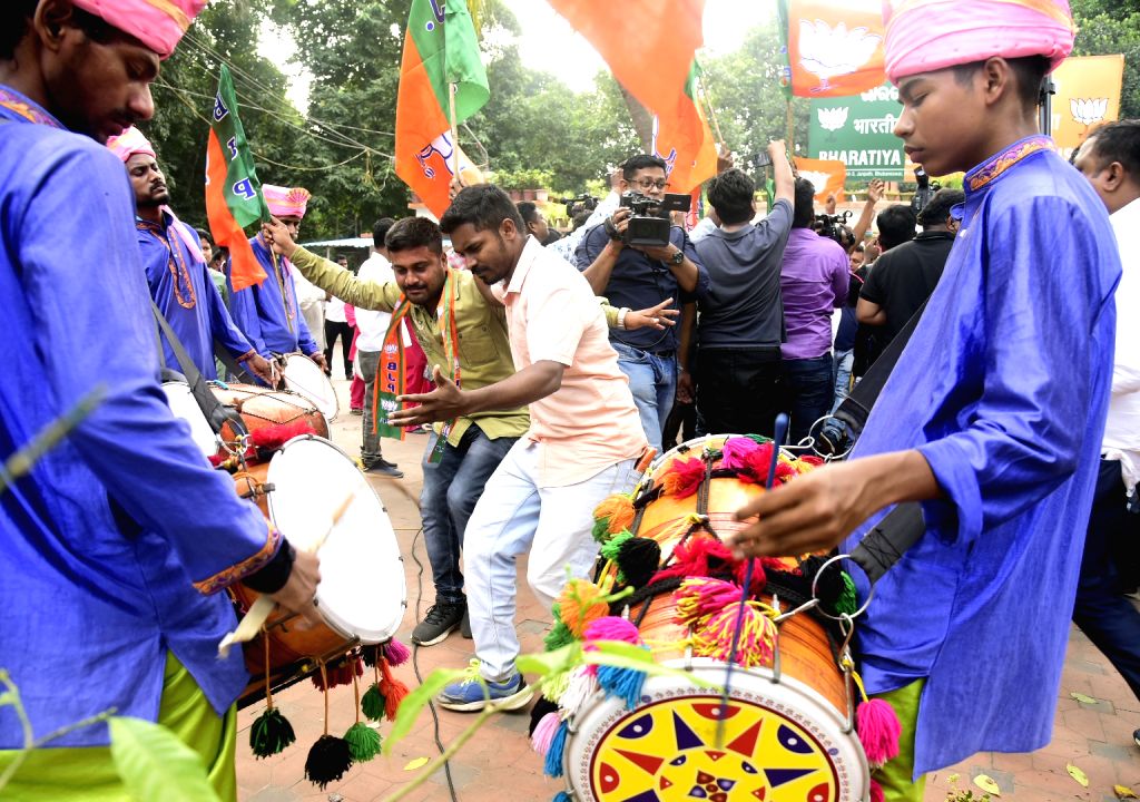 Bjp workers celebrate after victory in Dhamnagar By-election